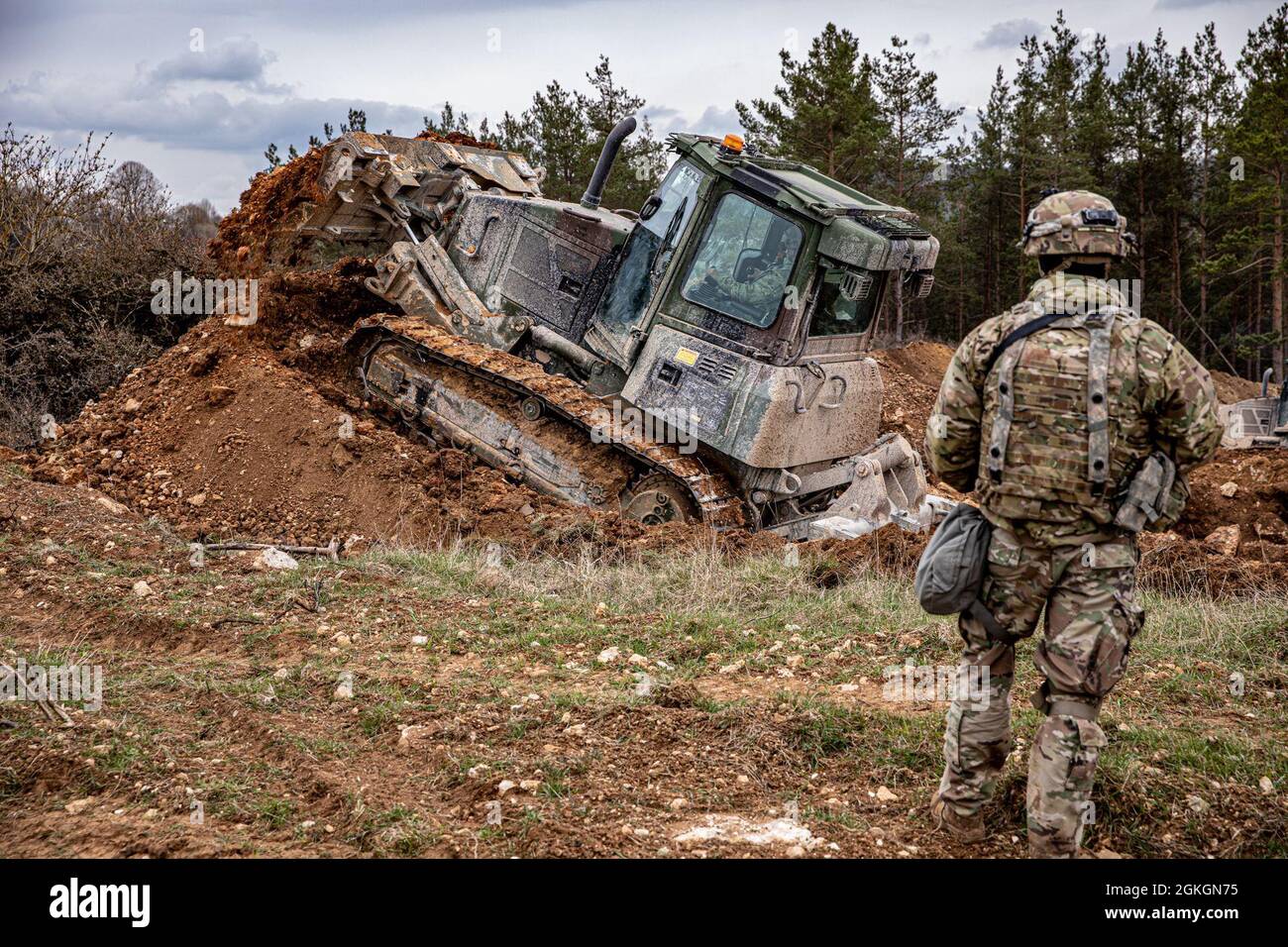 U.S. Army Pvt. Dalton Leonard, a D6K Light Bulldozer operator assigned ...