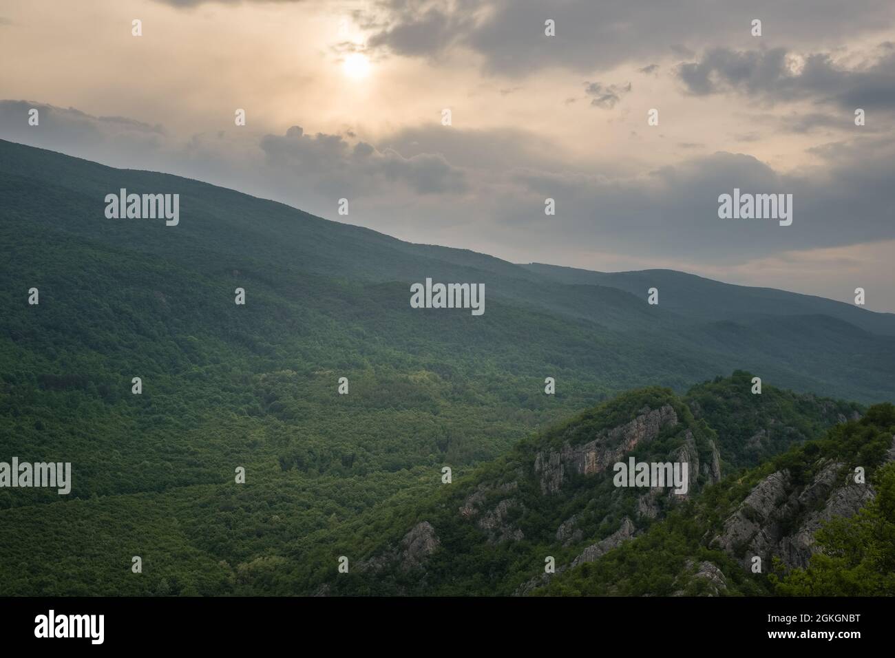 Beautiful soft light from the Sun behind the clouds falling on the ...