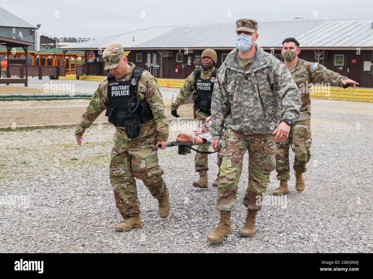 U.S. Soldiers assigned to Regional Command-East, Kosovo Force carry a ...