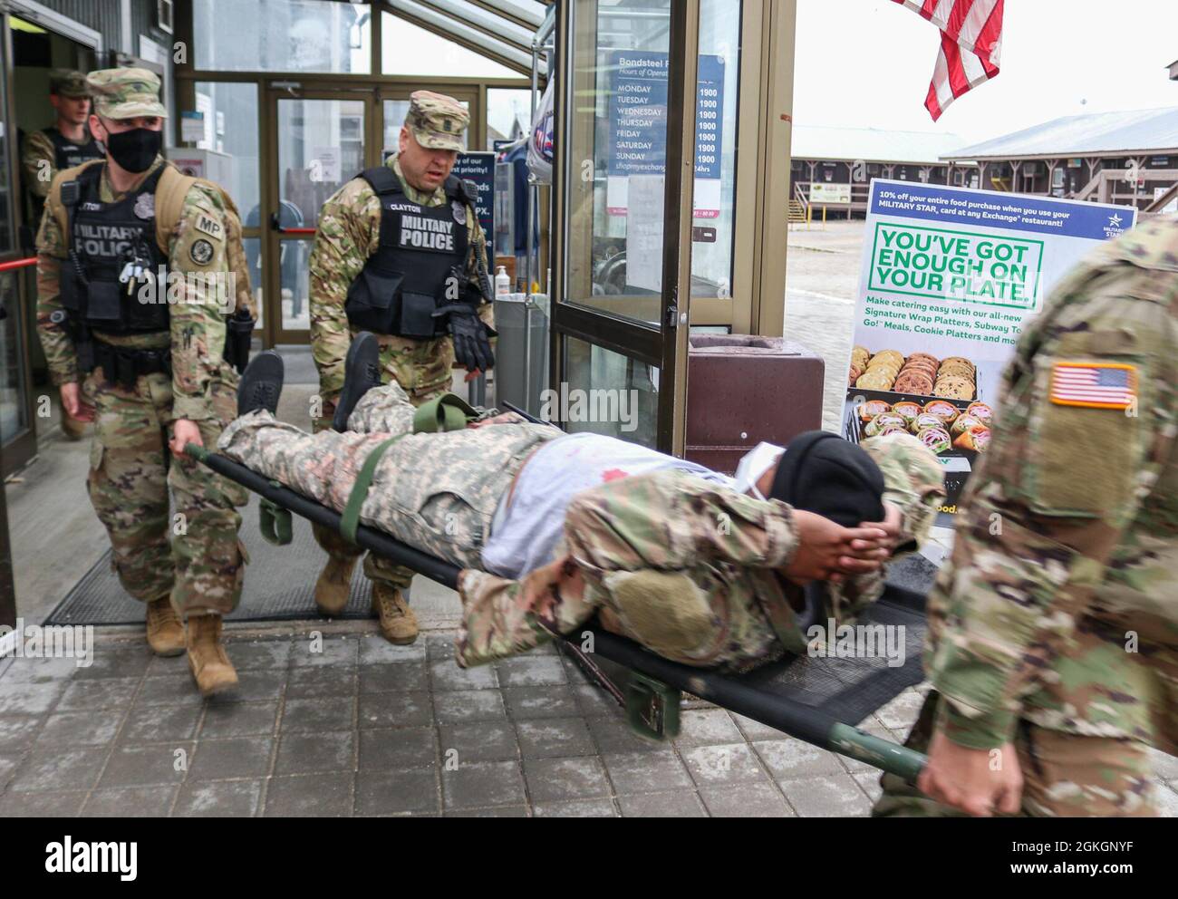 U.S. Soldiers assigned to Regional Command-East, Kosovo Force carry a ...