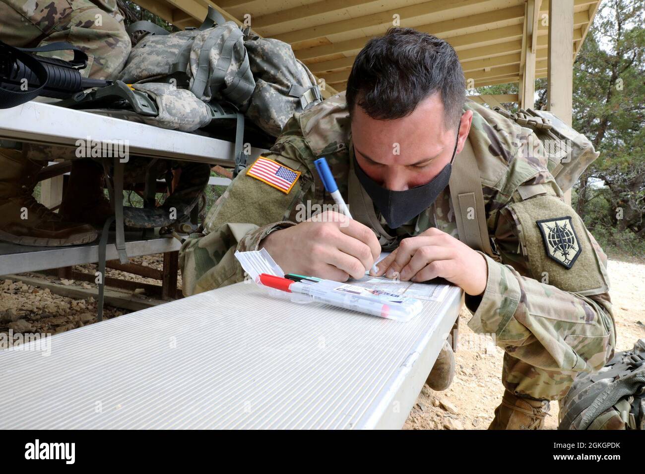 Staff Sgt. Myles Kalf, 323rd Military Intelligence Battalion, plots map ...