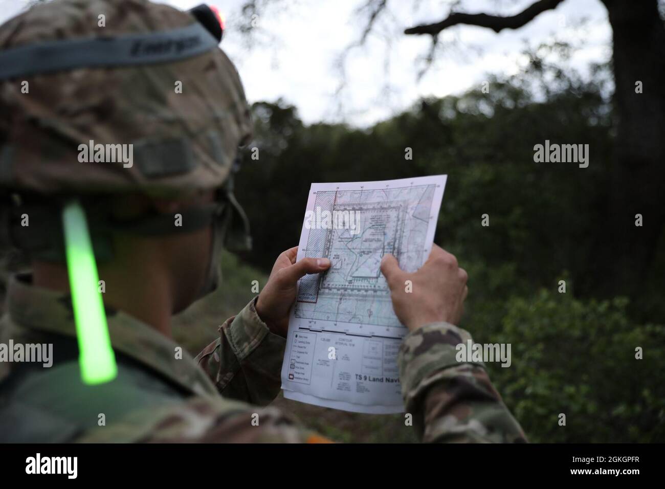 Spc. Karhl Wayman double checks his map plot during the nighttime land ...