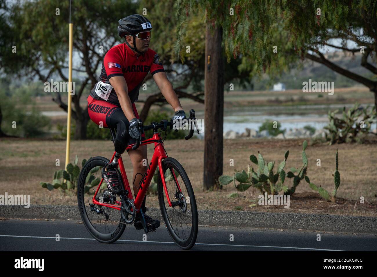 U.S. Marine Corps Capt. Thomas Benge competes in the cycling time ...