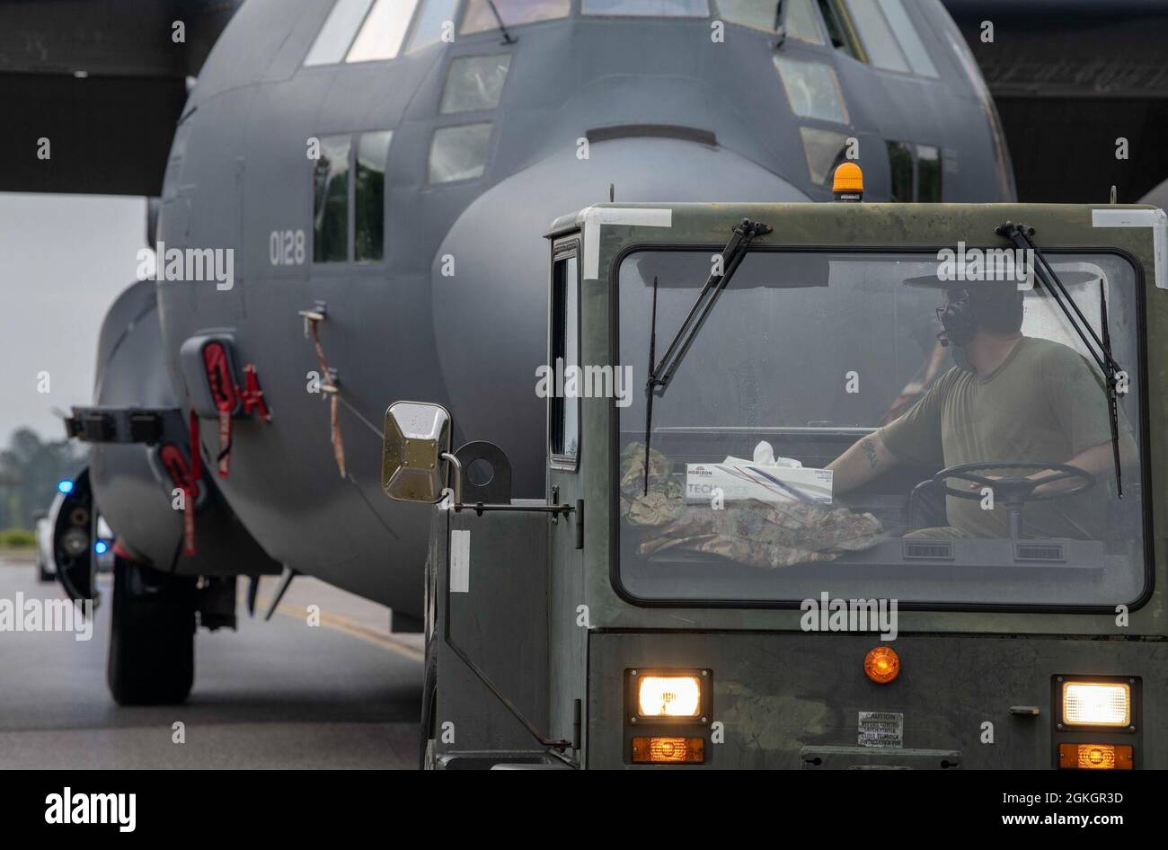 An Air Commando with the 1st Special Operations Aircraft Maintenance Squadron tows an AC-130U ...