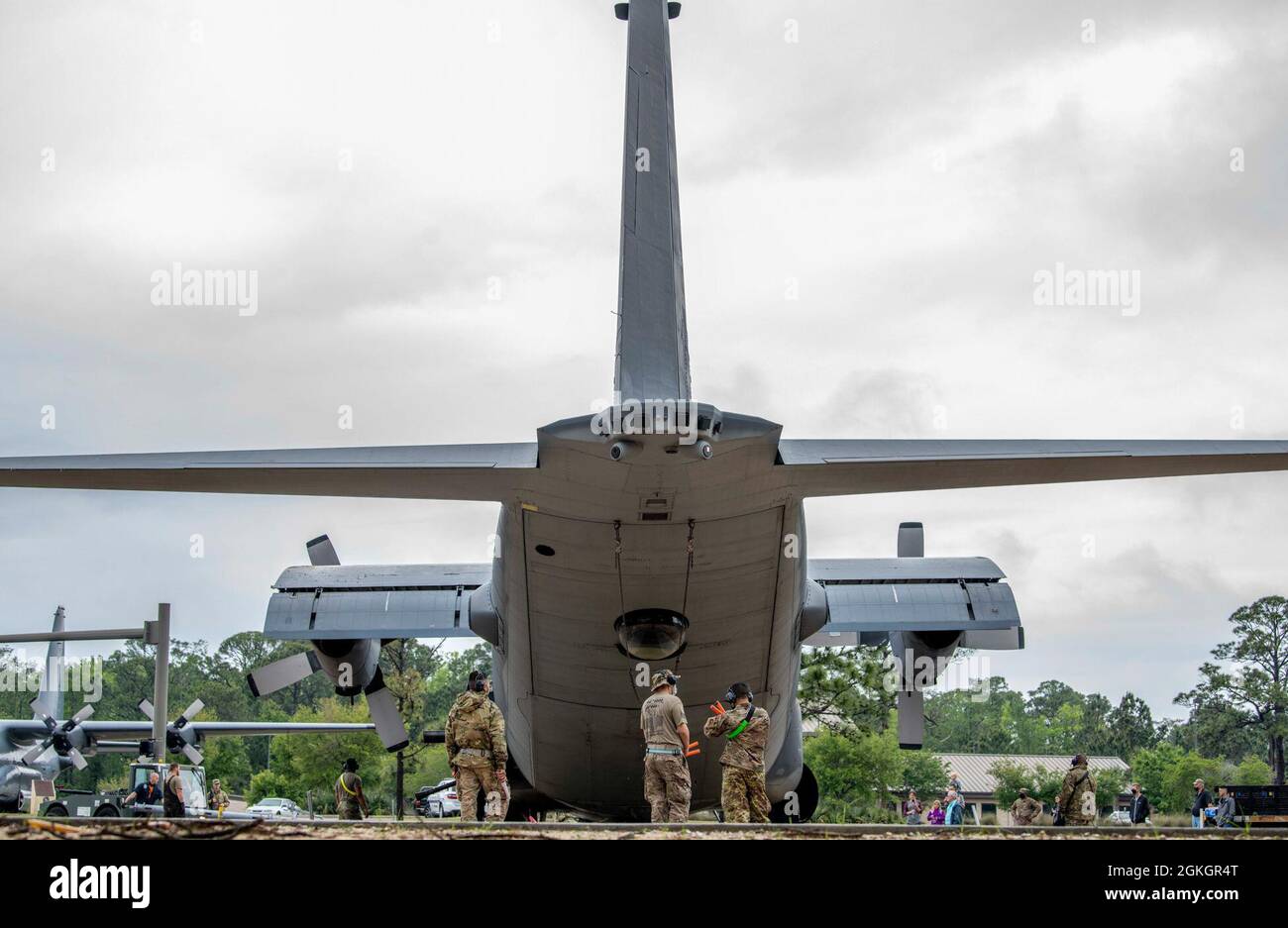 Air Commandos with the 1st Special Operations Aircraft Maintenance Squadron push an AC-130U ...