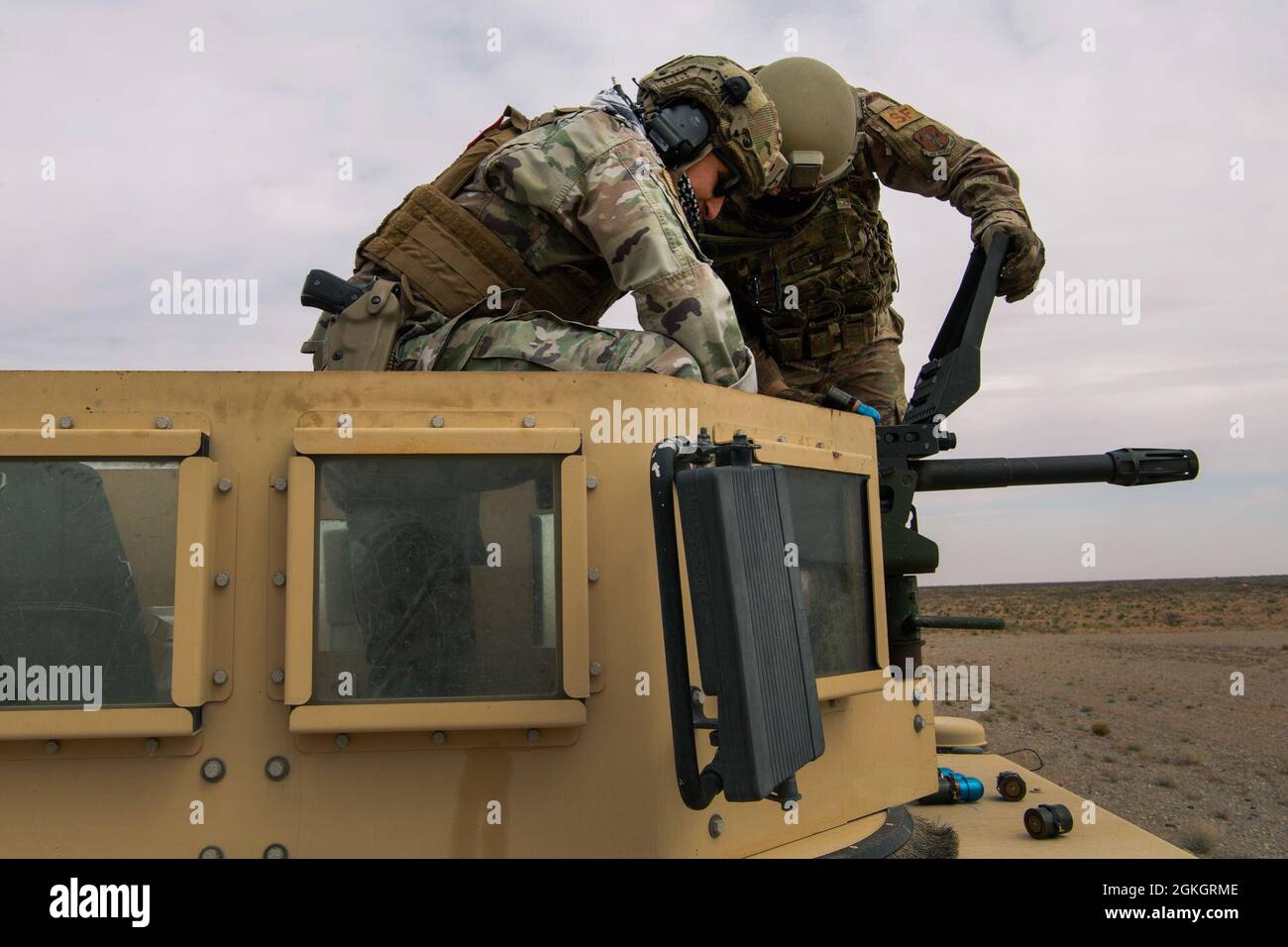 Members of the 204th Security Forces Squadron reload a Mk-19 grenade ...