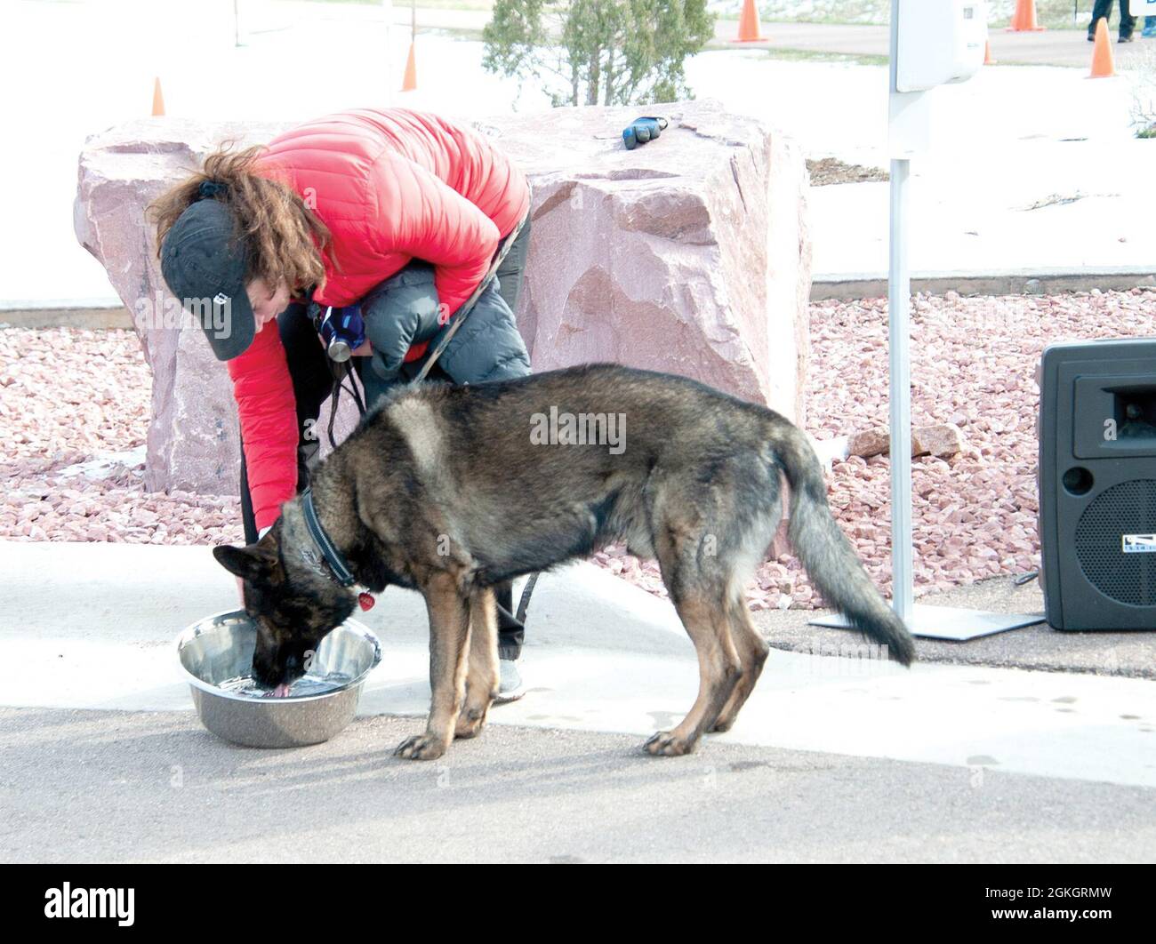 FORT CARSON, Colo. — A Fort Carson Family member gives her dog water ...