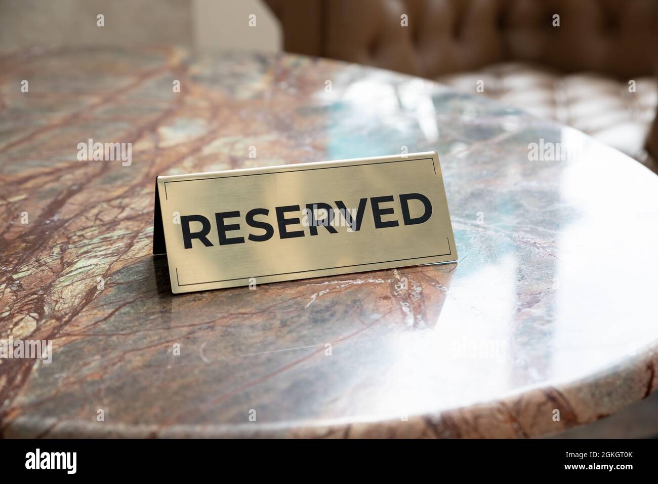 Plastic plaque with the inscription Reserved on the restaurant table ...