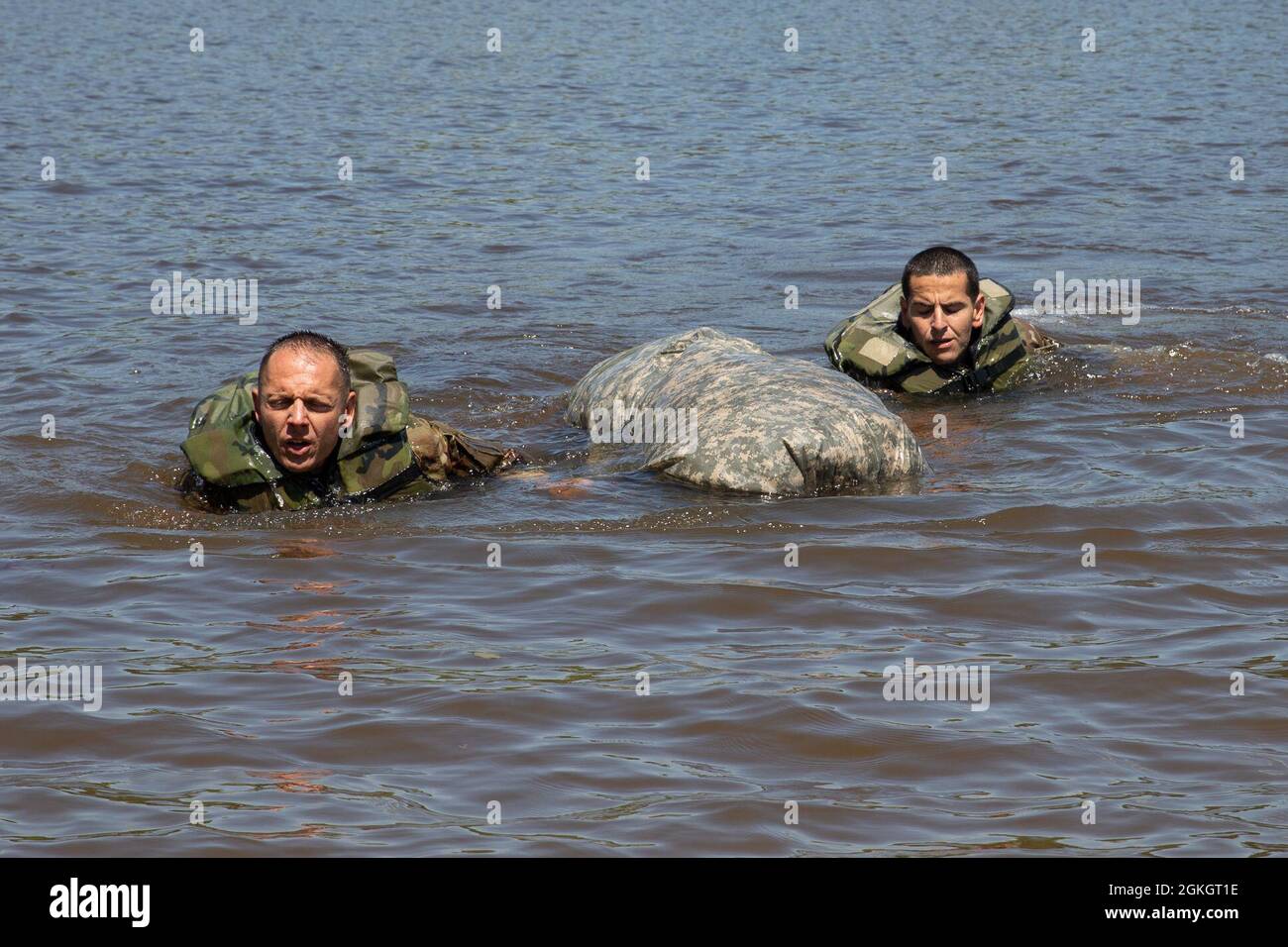 Rangers swim while participating in a combat water survival assessment ...