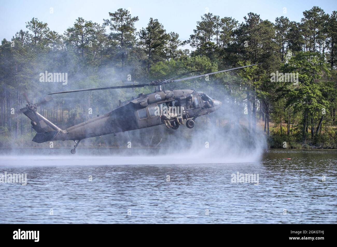 United States Army Rangers fly in on a Black Hawk and prepare to ...