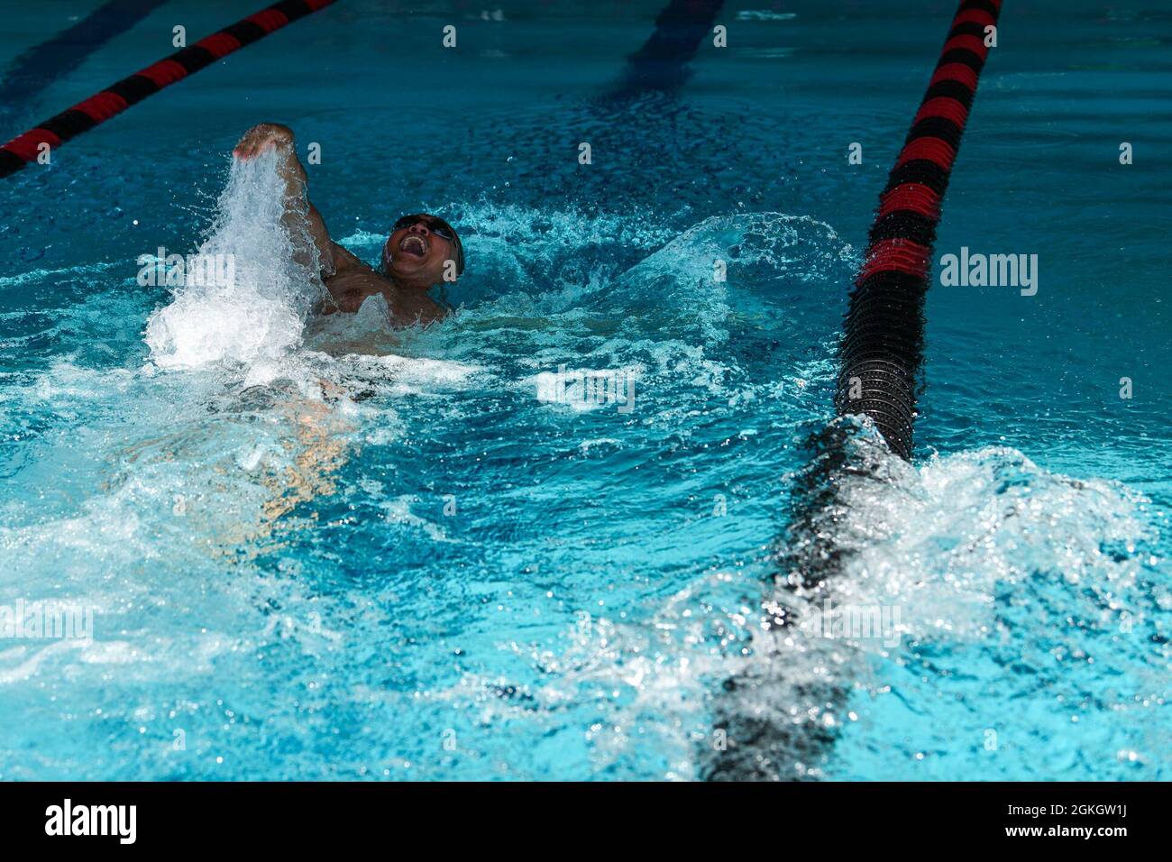 U.S. Marine Corps Lance Cpl. Marcus Micks competes in the swimming ...