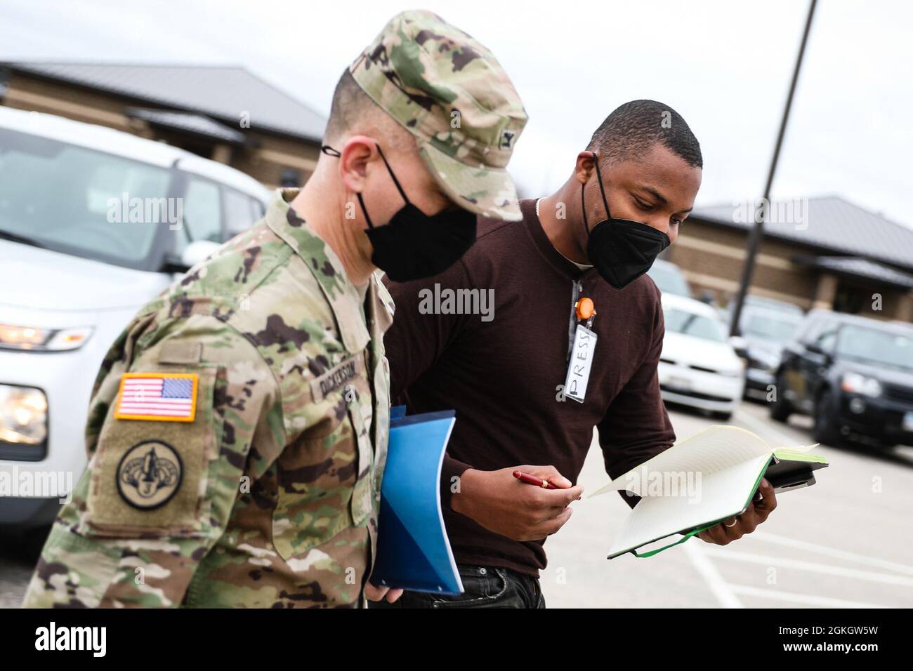 U.S. Army Reserve Capt. David Adams, right, a plans officer with the ...