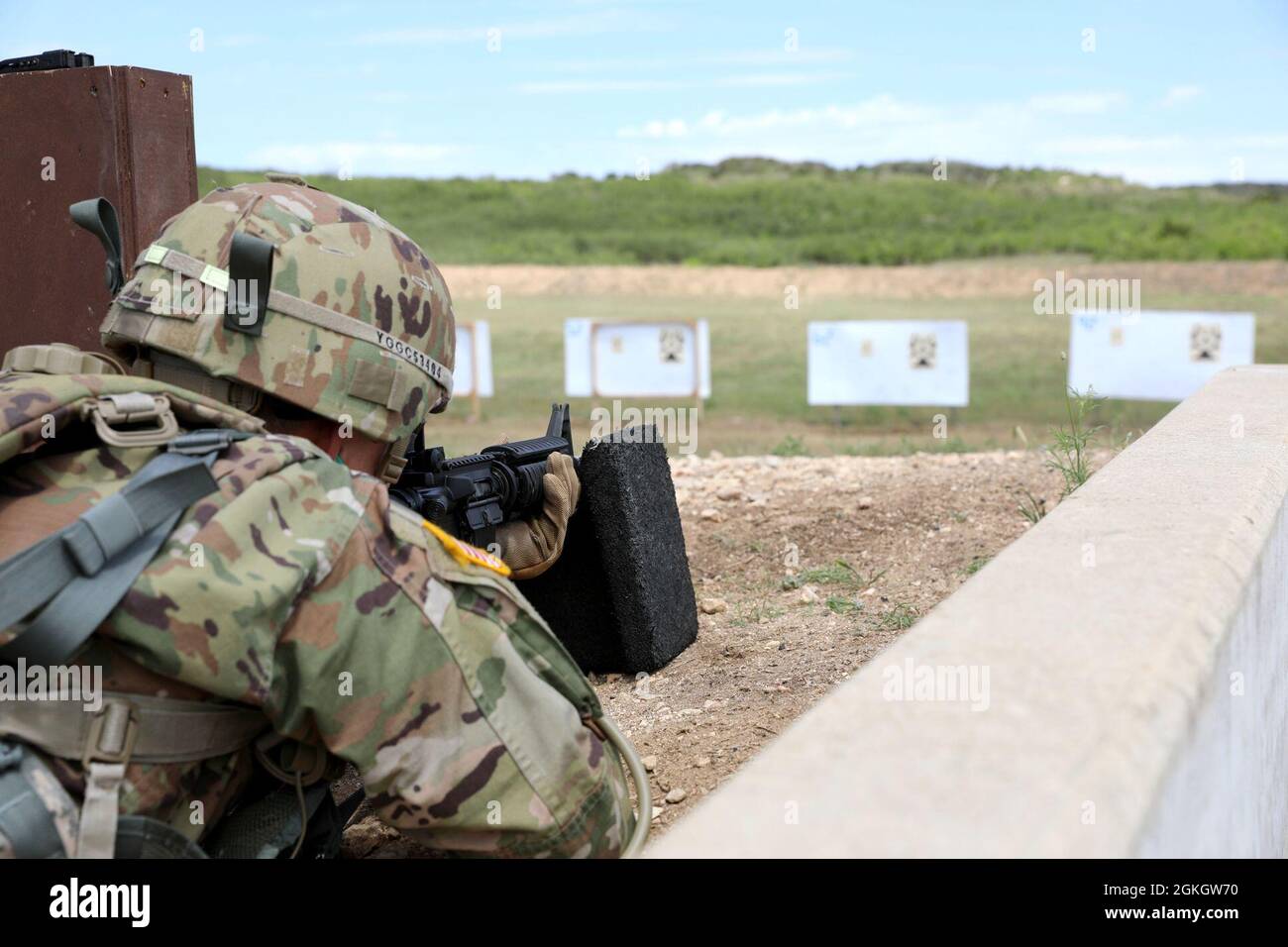 Spc. Christopher Thompson fires an M4 carbine during the weapon ...