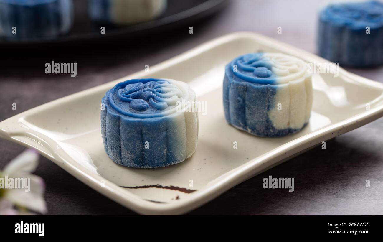 Blue white snowskin moon cake Stock Photo - Alamy