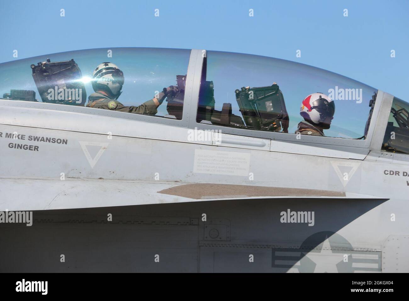 Lt. Kevin Rafter (front) and Commander Dustin Engel of the U.S. Navy ...