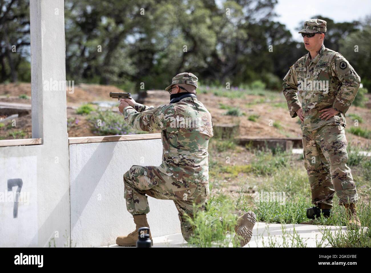 U.S. Army Sgt. 1st Class Richard Heinzman fires a SIG Sauer P320-M17 ...