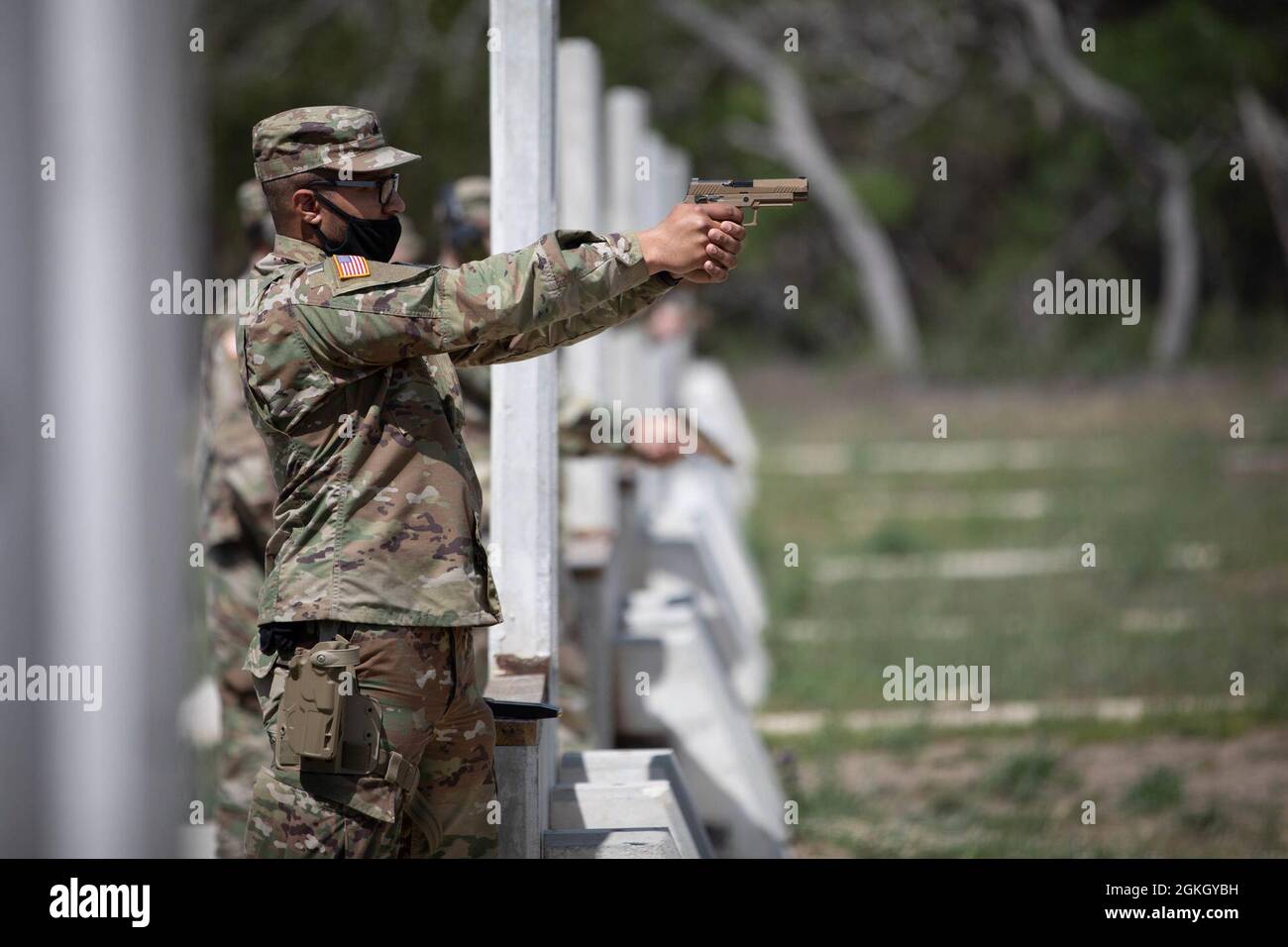 A U.S. Army Soldier points and fires his SIG Sauer P320-M17, semi ...