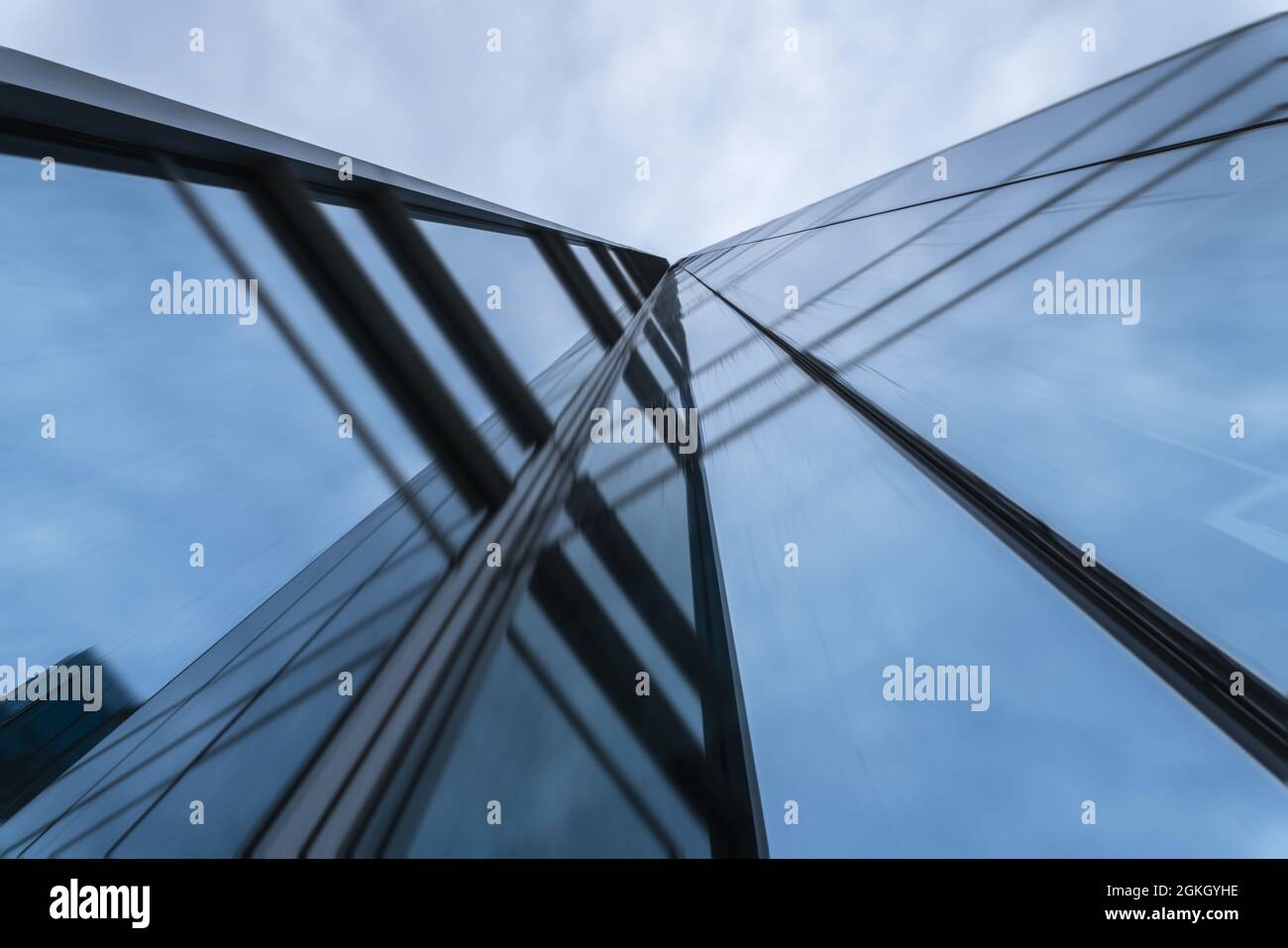 Low angle shot of the exterior of a modern building with glass walls ...