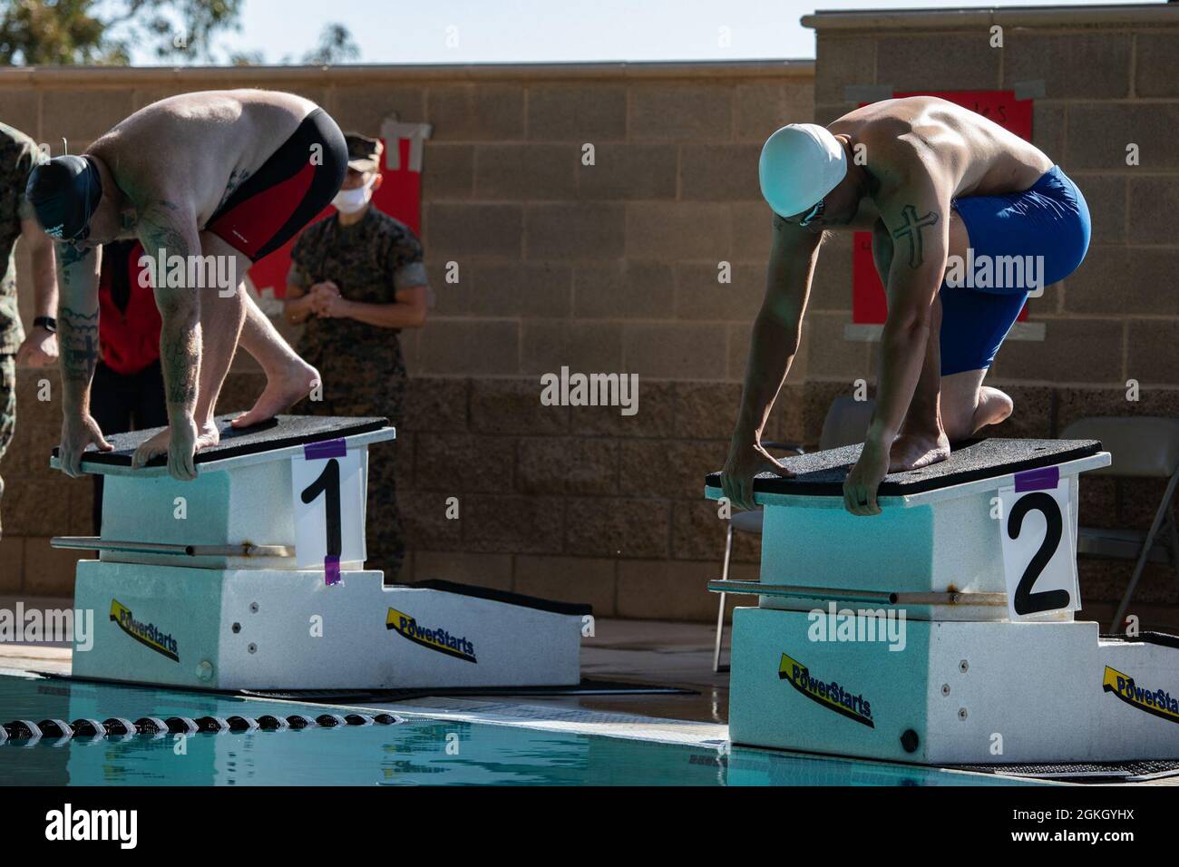U.S. Marine Corps Capt. Thomas Benge competes in the swimming finals ...