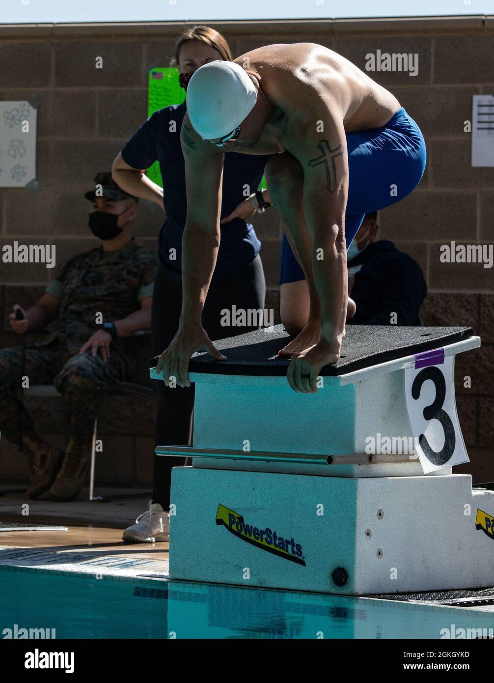 U.S. Marine Corps Capt. Thomas Benge competes in the swimming finals ...