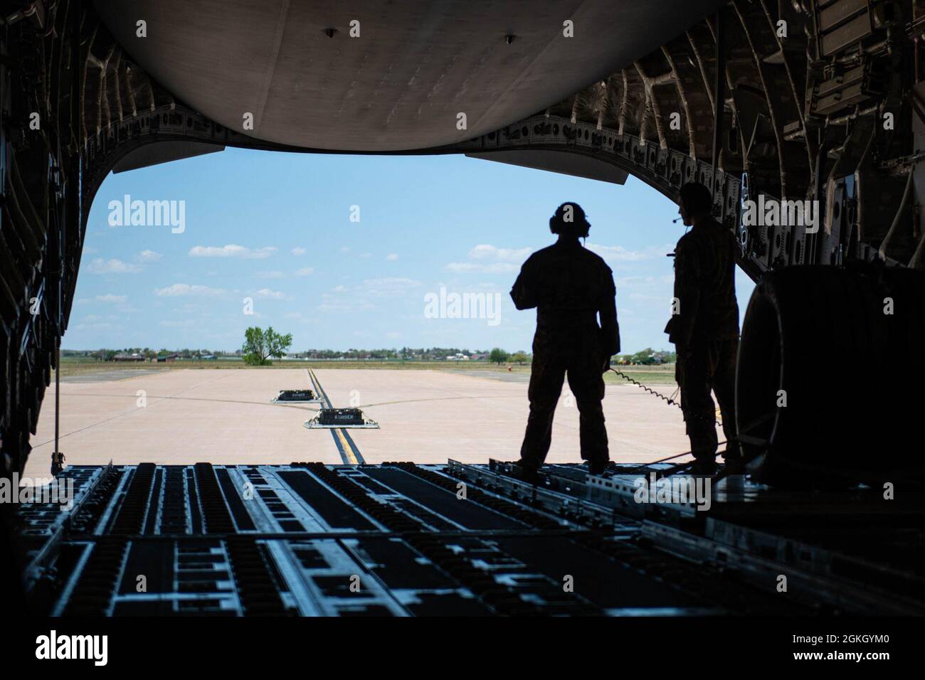 Loadmasters assigned to the 58th Air Refueling Squadron stand at the ...