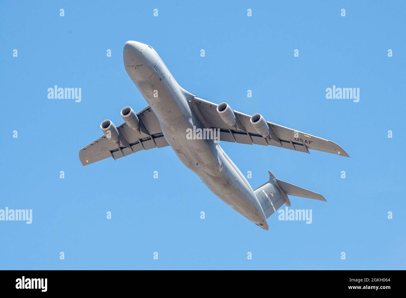 A C-5M Super Galaxy flies over Travis Air Force Base, California, April ...