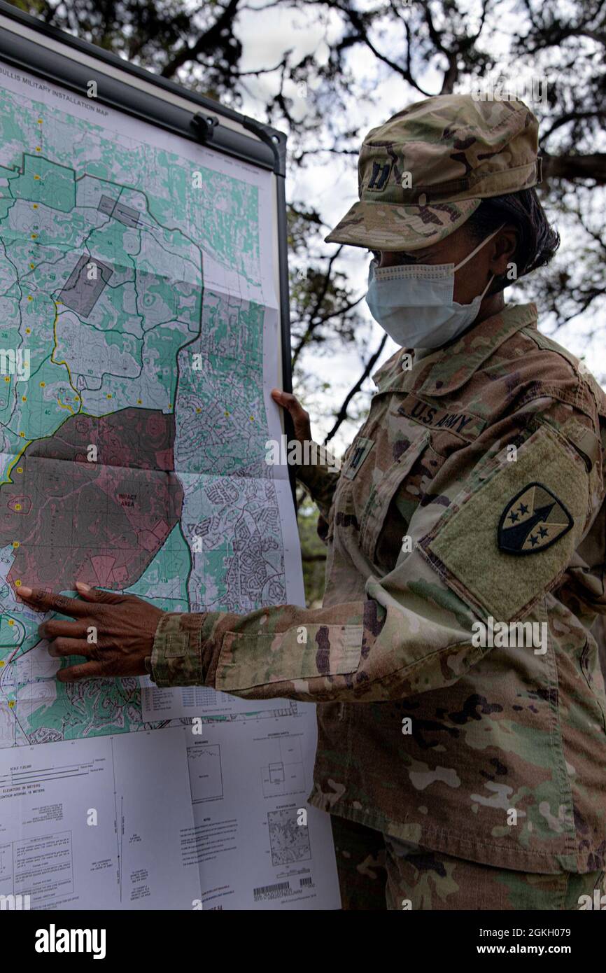 U.S. Army Capt. Delicia Battle points to one of the map coordinates ...