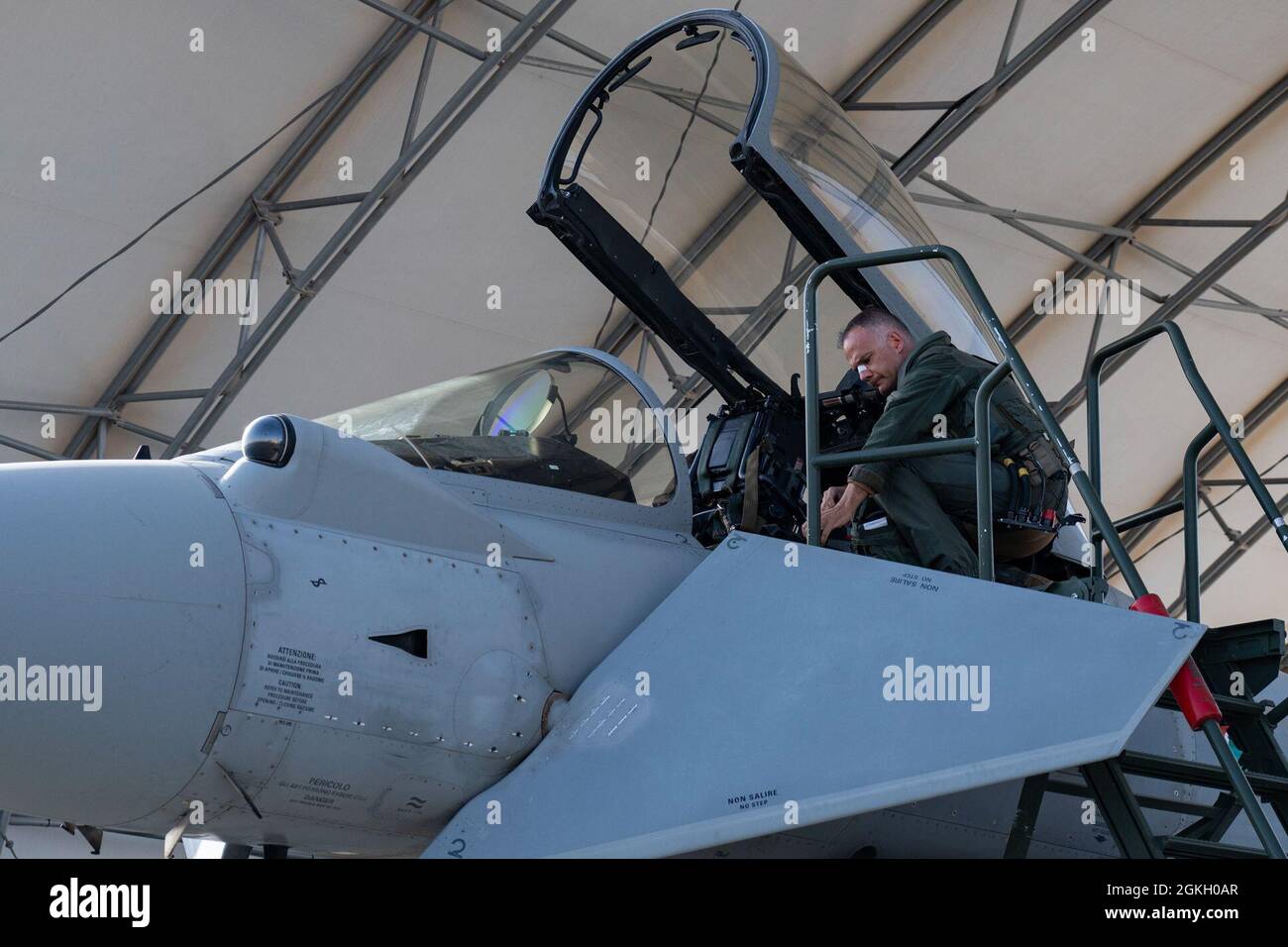 An Italian Air Force pilot inspects the cockpit of an F-2000 ...