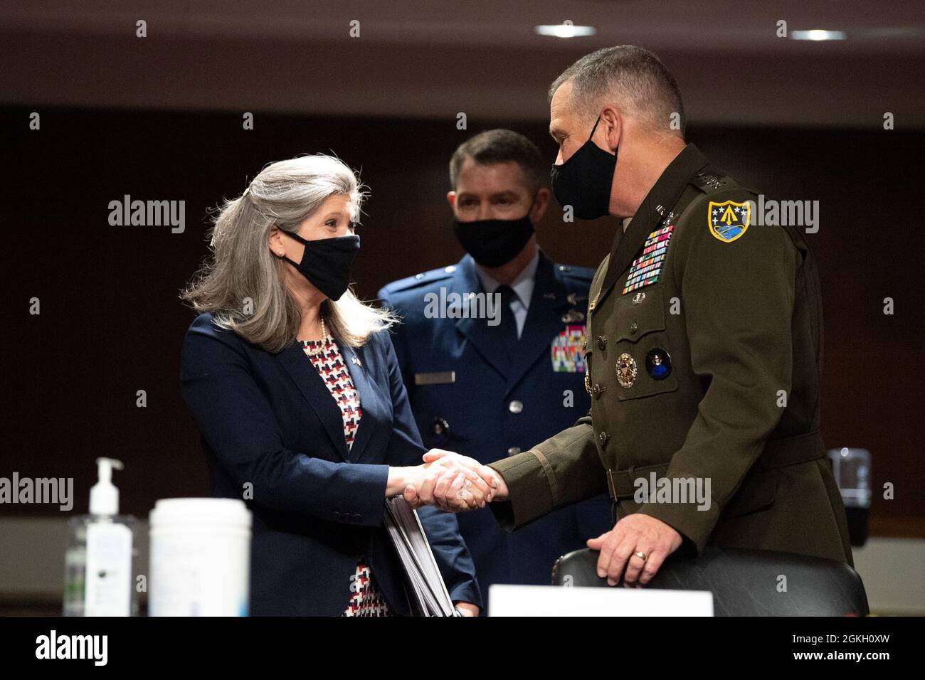 U.S. Joni Ernst (R-Iowa) greets Gen. James H. Dickinson, commander U.S ...