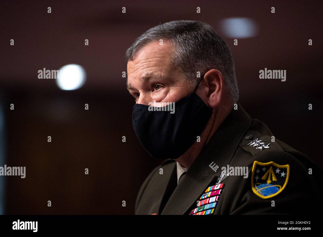 Gen. James H. Dickinson, commander U.S. Space Command, listens to ...