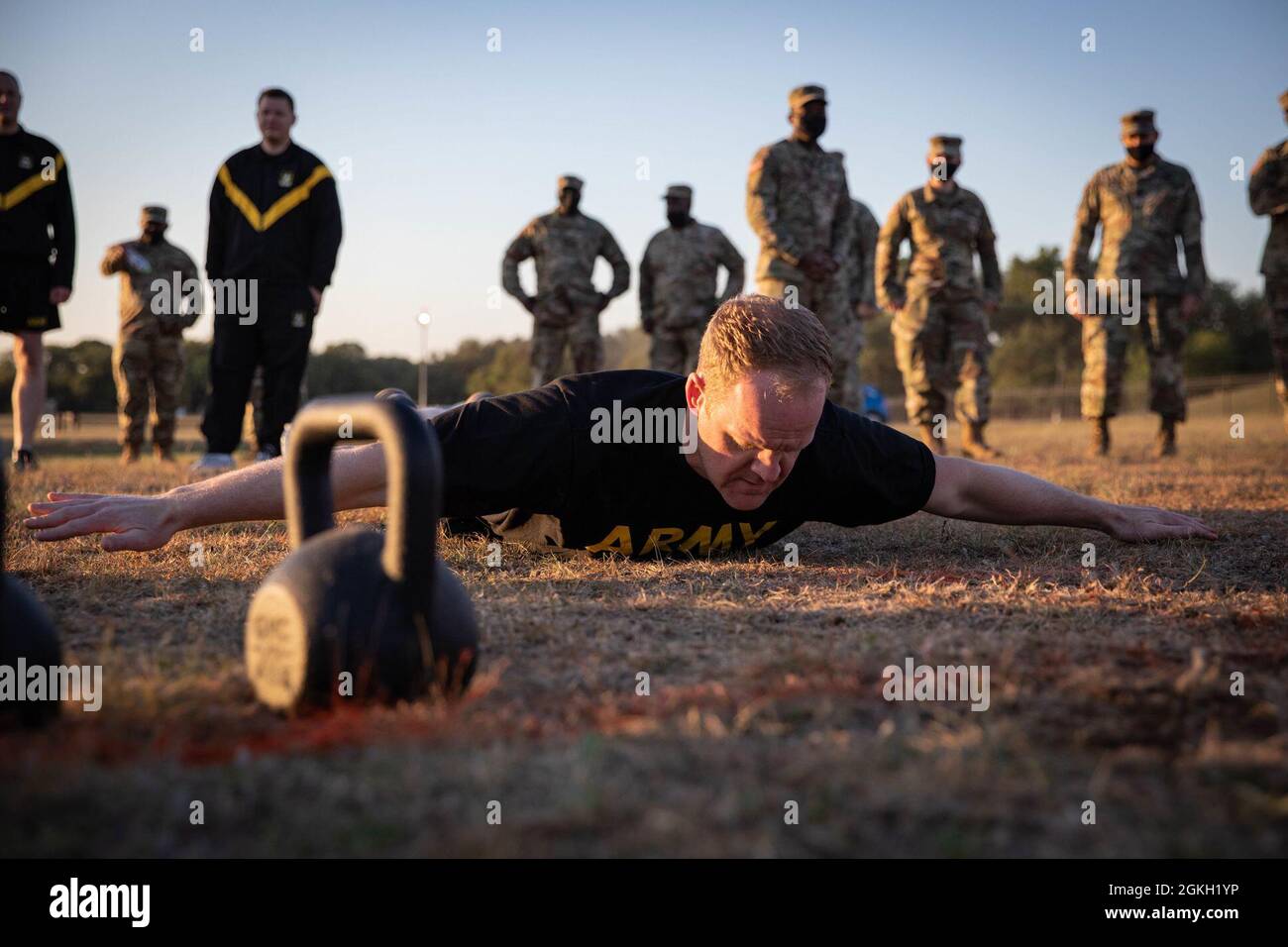 U.S. Army Sgt. 1st Class Brandon Morrison attempts a proper push-up for ...