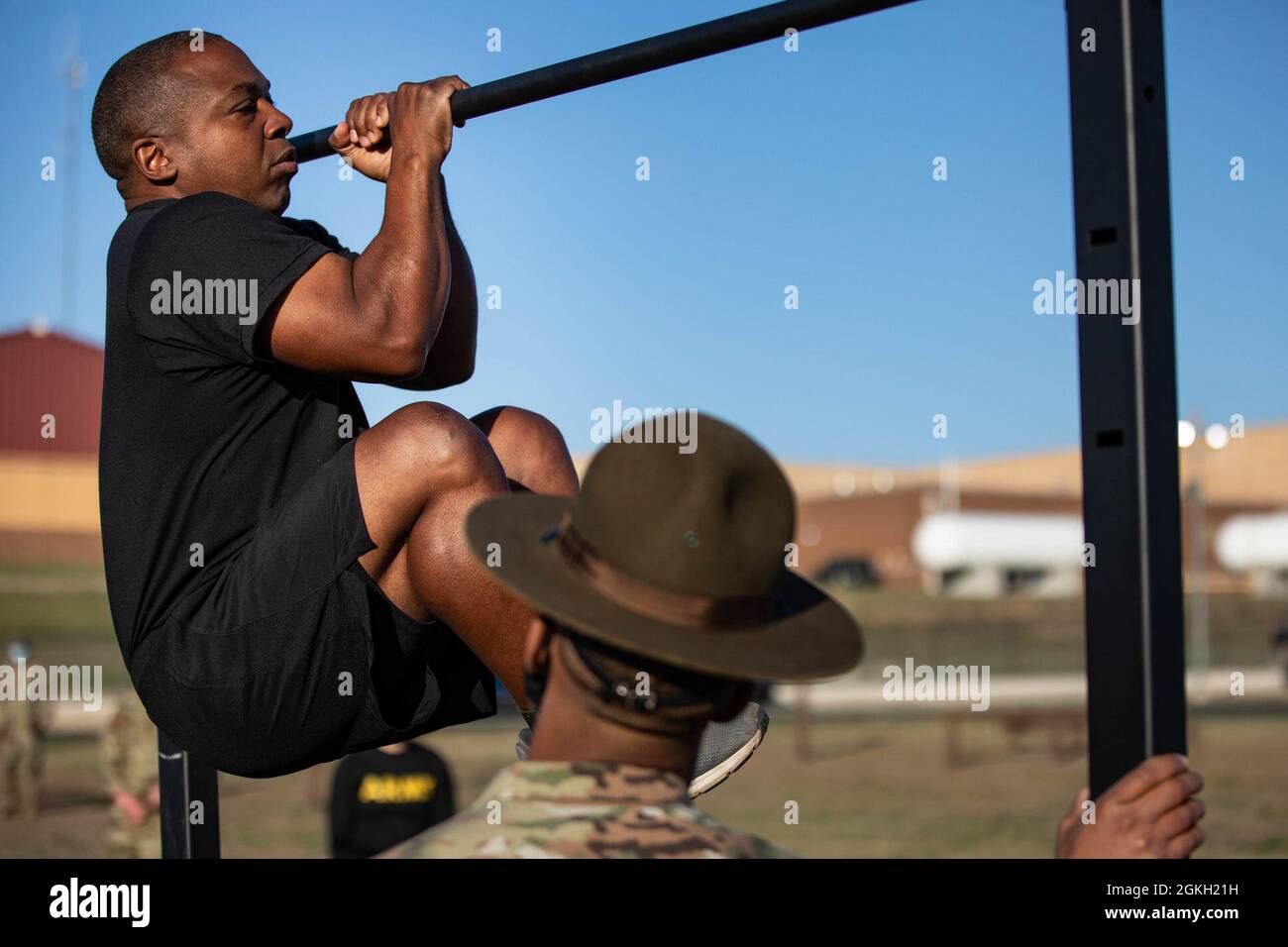 U.S. Army Maj. Derrick Robey completes a proper leg tuck for the leg ...