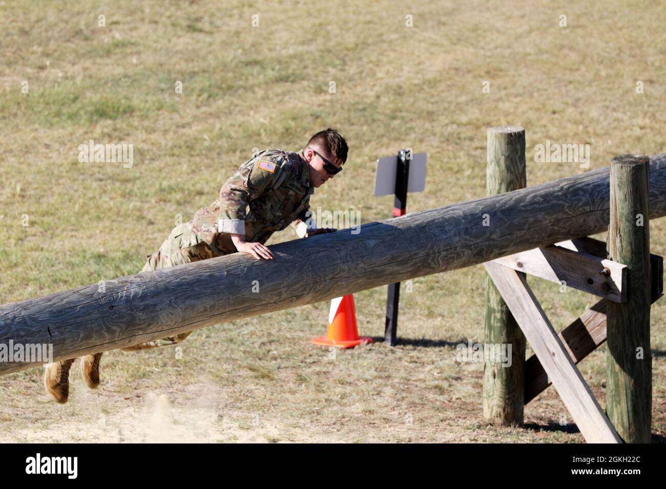 Pfc. Alec Waterman, 383rd Military Intelligence Battalion, vaults over ...