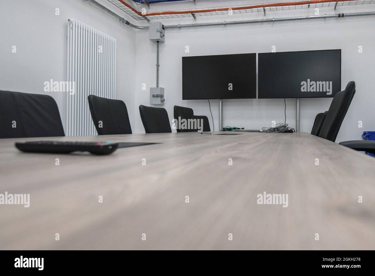 Photo shows a pair of 55" monitors, provided by Training Support ...