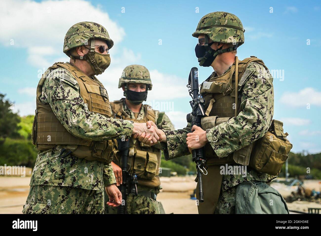 U.S. Navy Sailor UT2 Timothy Dowding, right, utilitiesman with Naval ...