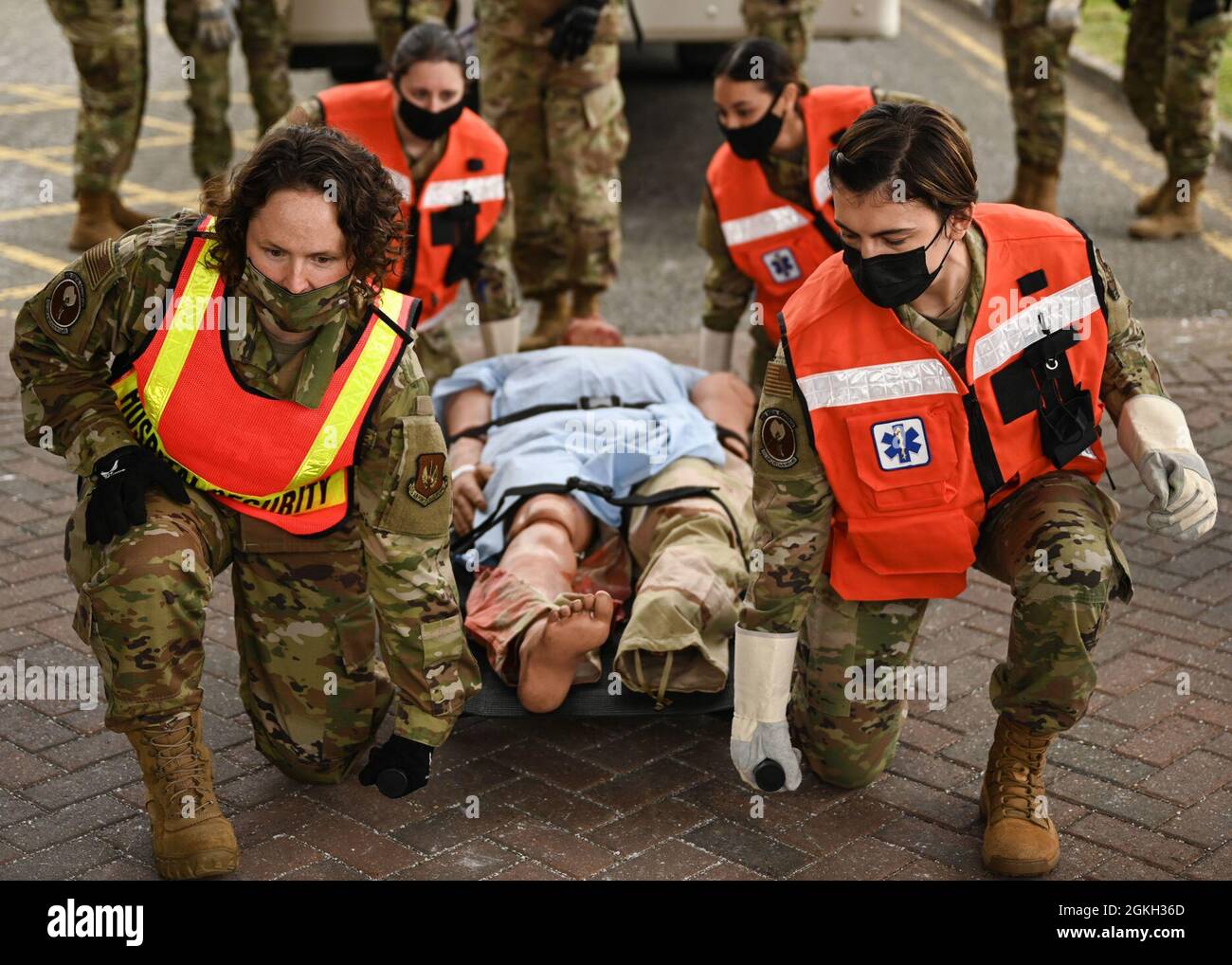 Airmen assigned to the 48th Medical Group lift a simulated casualty ...