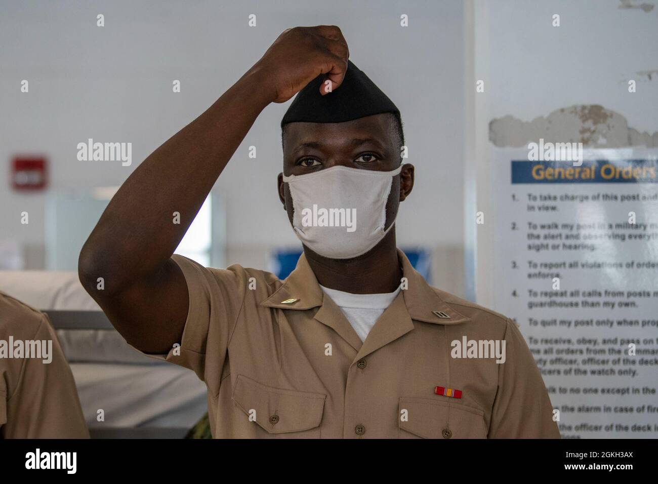 A recruit prepares to uncover during a phase 3 personnel inspection ...