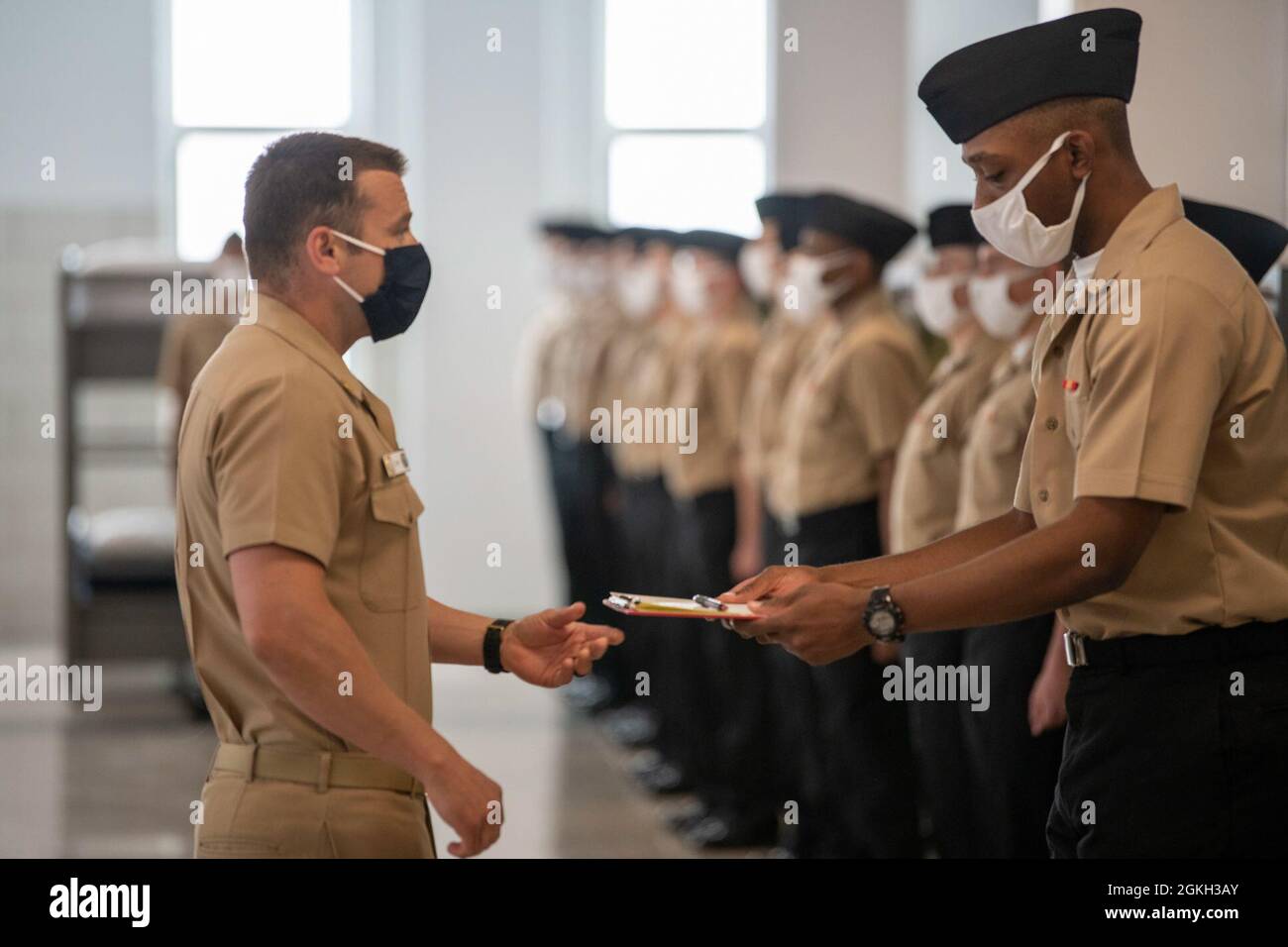 Chief Naval Aircrewman (Tactical Helicopter) Ryan Quinn, an inspector ...