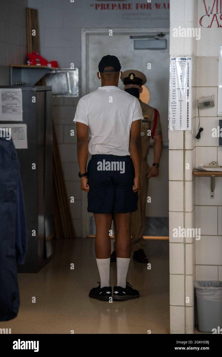 The recruit chief petty officer for division 222 greets the inspector ...