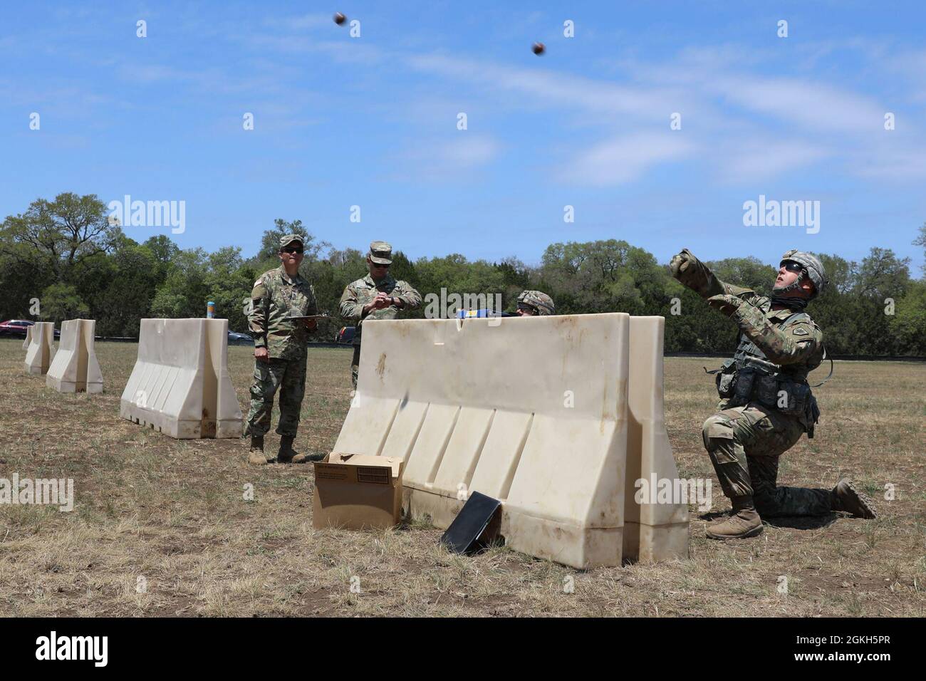 Sgt. Joshua Miller, 368th Military Intelligence Battalion, throws an ...