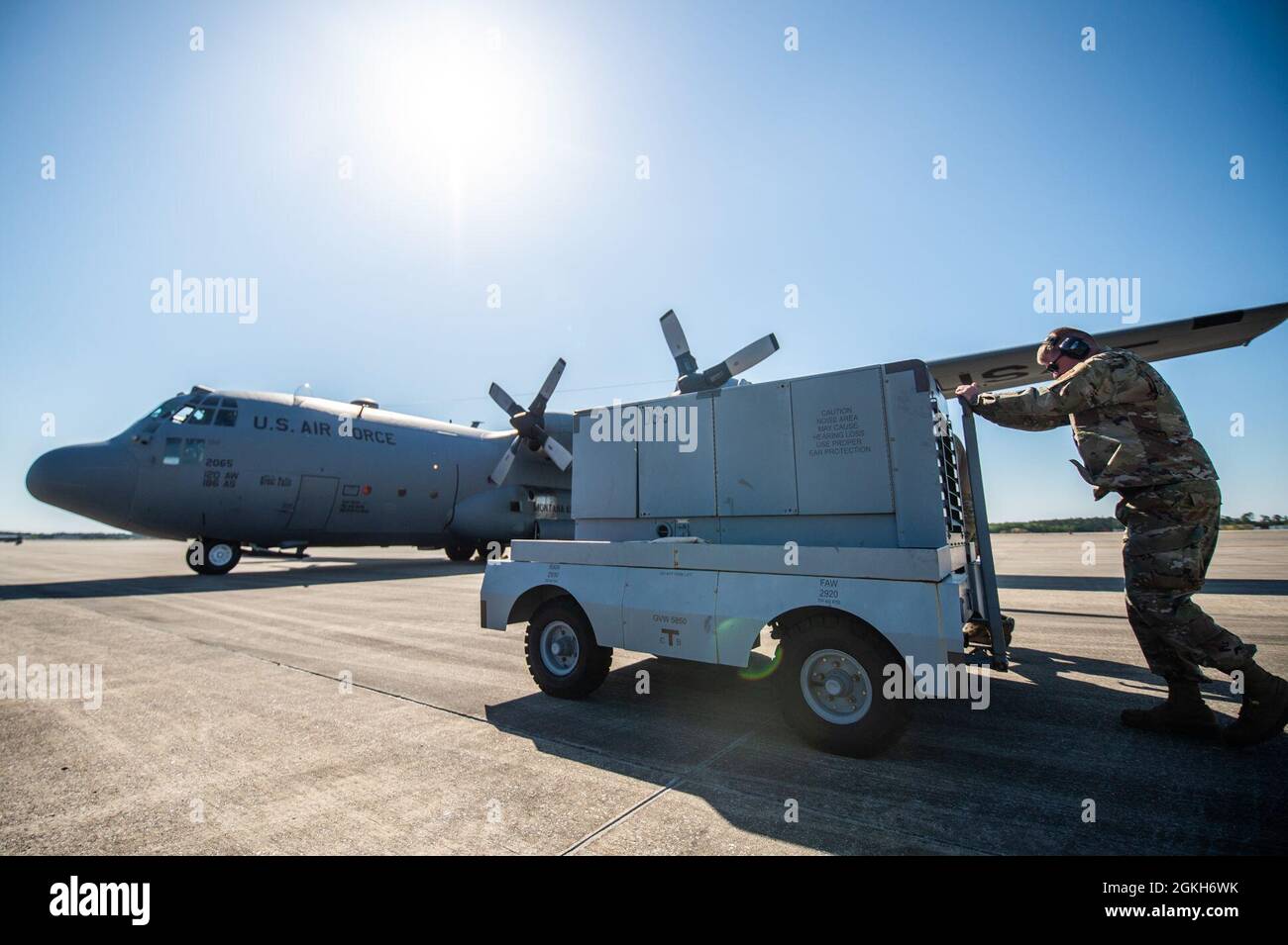 A member of the 120th Airlift Wing, Montana Air National Guard, moves ...