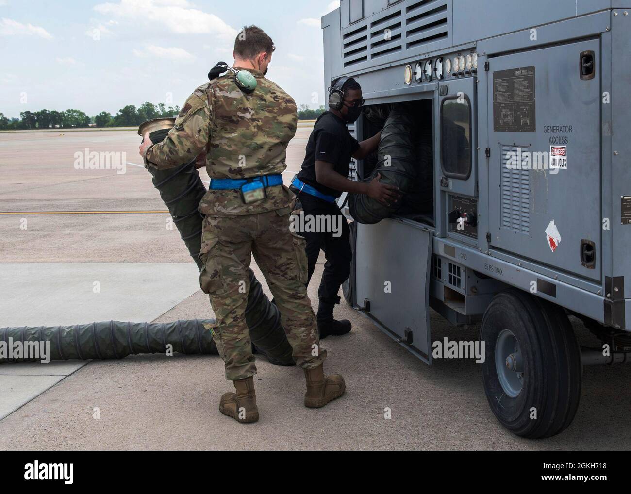 Airman First Class Kyle Woodson, right, and Senior Airman Paul Hearon ...