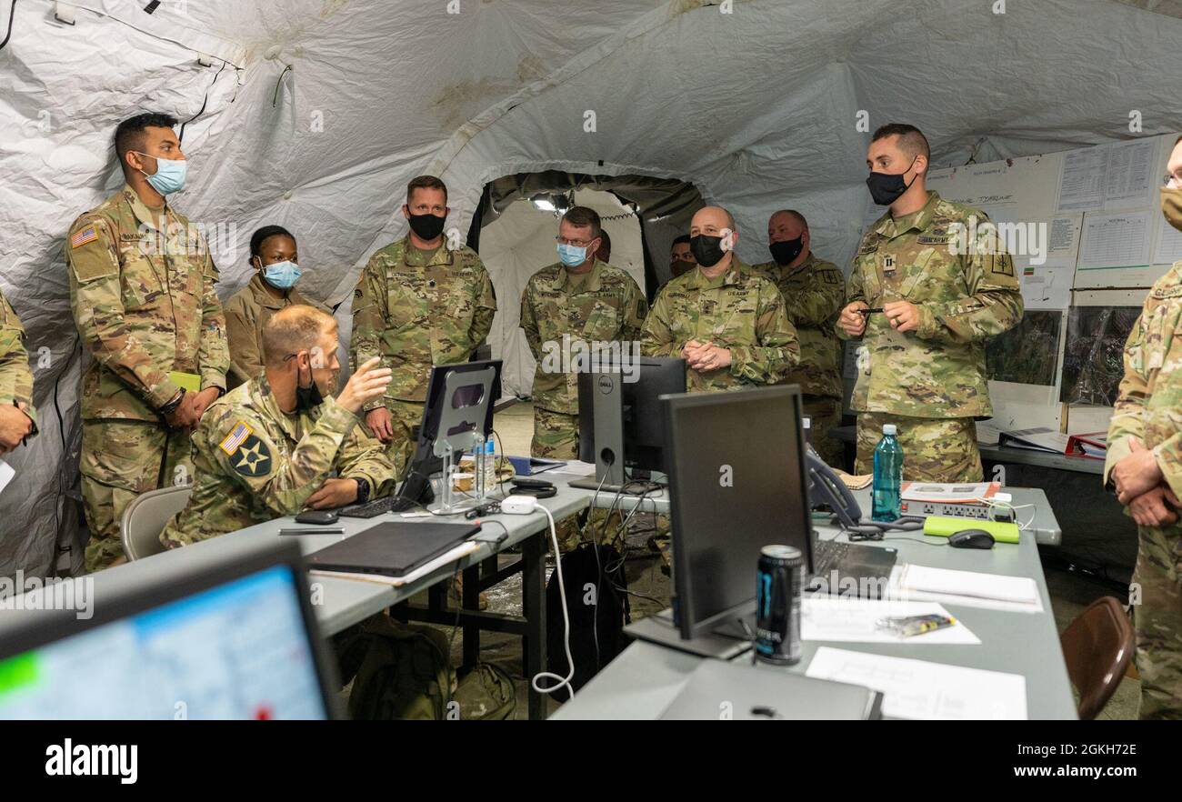 U.S. Army Maj. Nicholas Whaley (seated), executive officer of ...