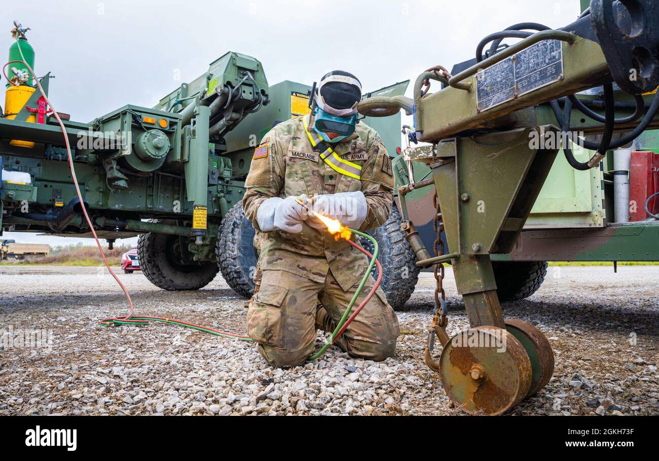 U.S. Army Spc. Phoenix Macrabie, a wheeled vehicle mechanic assigned to ...