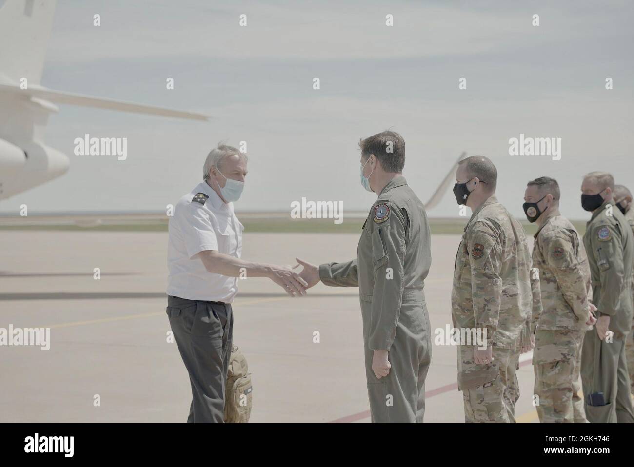 Belgian Chief of Defense, Admiral Michel Hofman, shakes hands with 80th ...