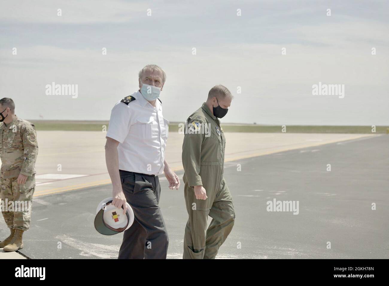 Belgian Chief of Defense, Admiral Michel Hofman, walks with 80th Flying ...