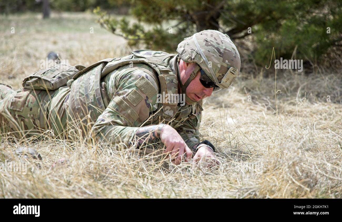 Staff Sergeant Brandon Grissom, 3rd EOD Bn, 707 EOD Co. probes around a ...