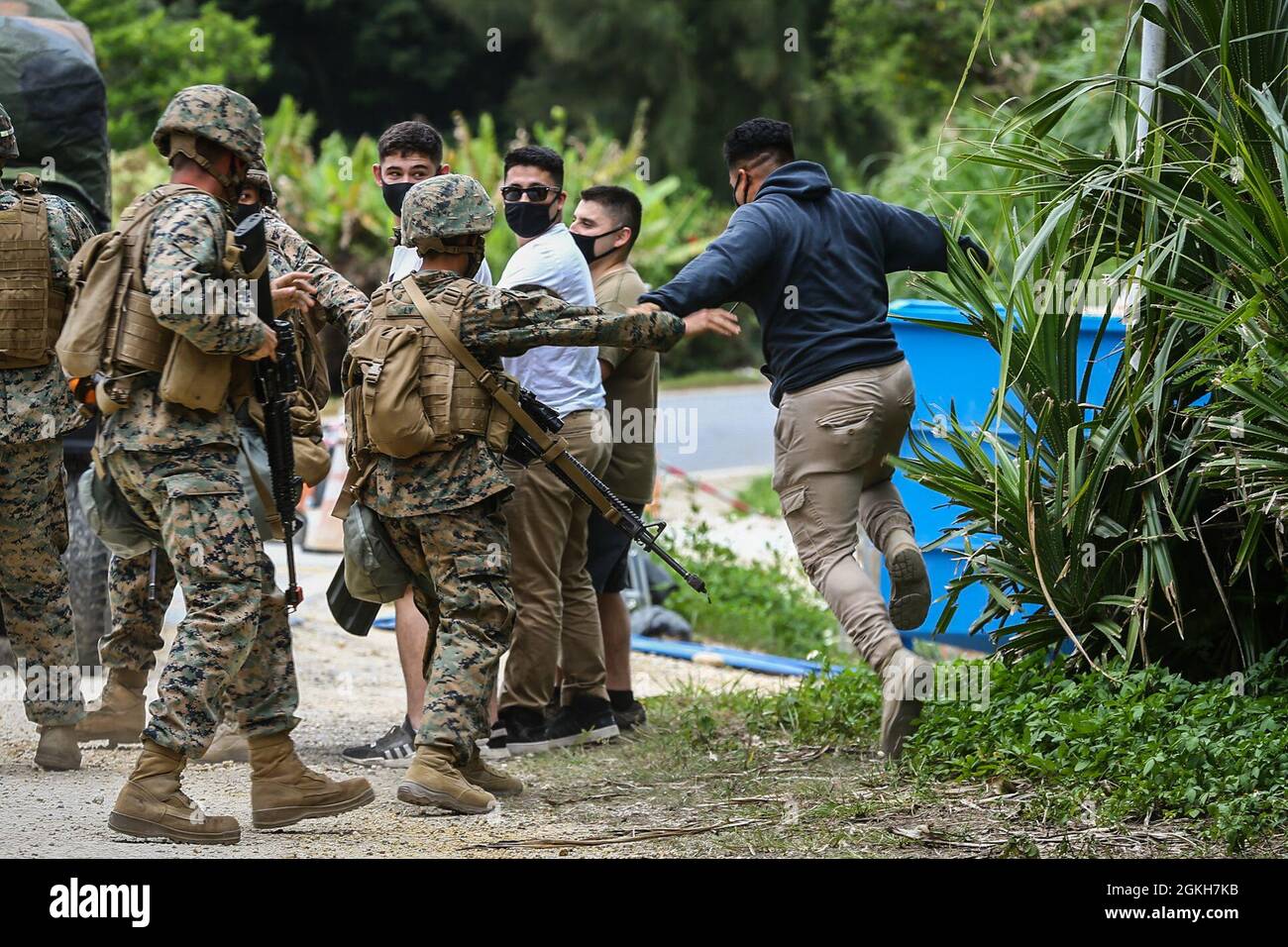 U.S. Marine Corps Lance Cpl. Bryan Mata, right, machine gunner with ...