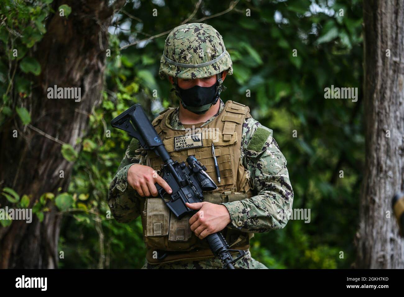 U.S. Navy Sailor UTCN Christian Bellin, utilitiesman with Naval Mobile ...