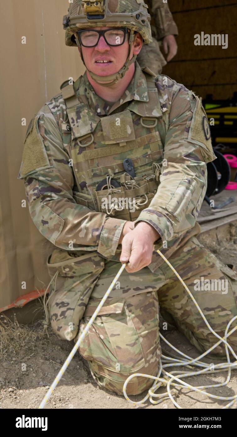Spc. Curtis Glasmeier, 242nd EOD Bn., 764th EOD Co., pulls on a rope ...